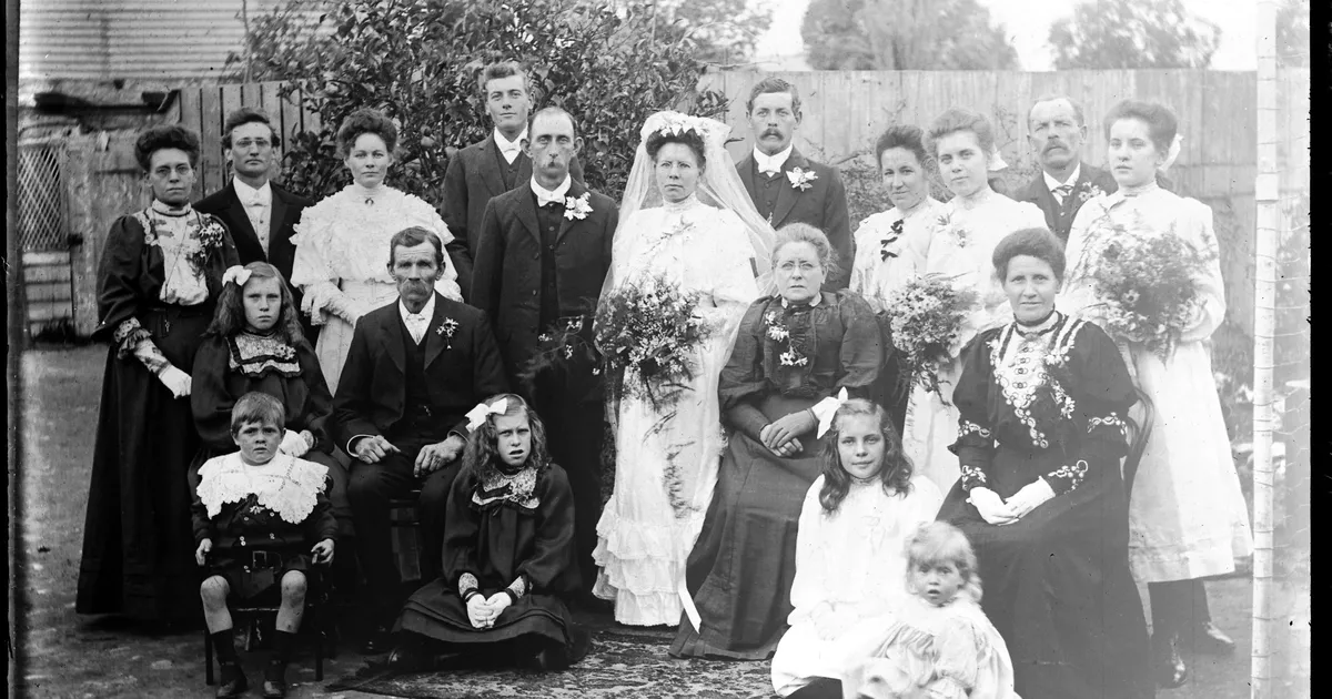 Blurred, overexposed photographic reproduction of wedding group ...