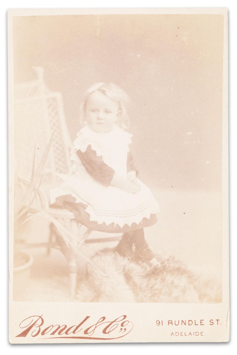 Portrait of little girl wearing white pinny - AGSA Collection