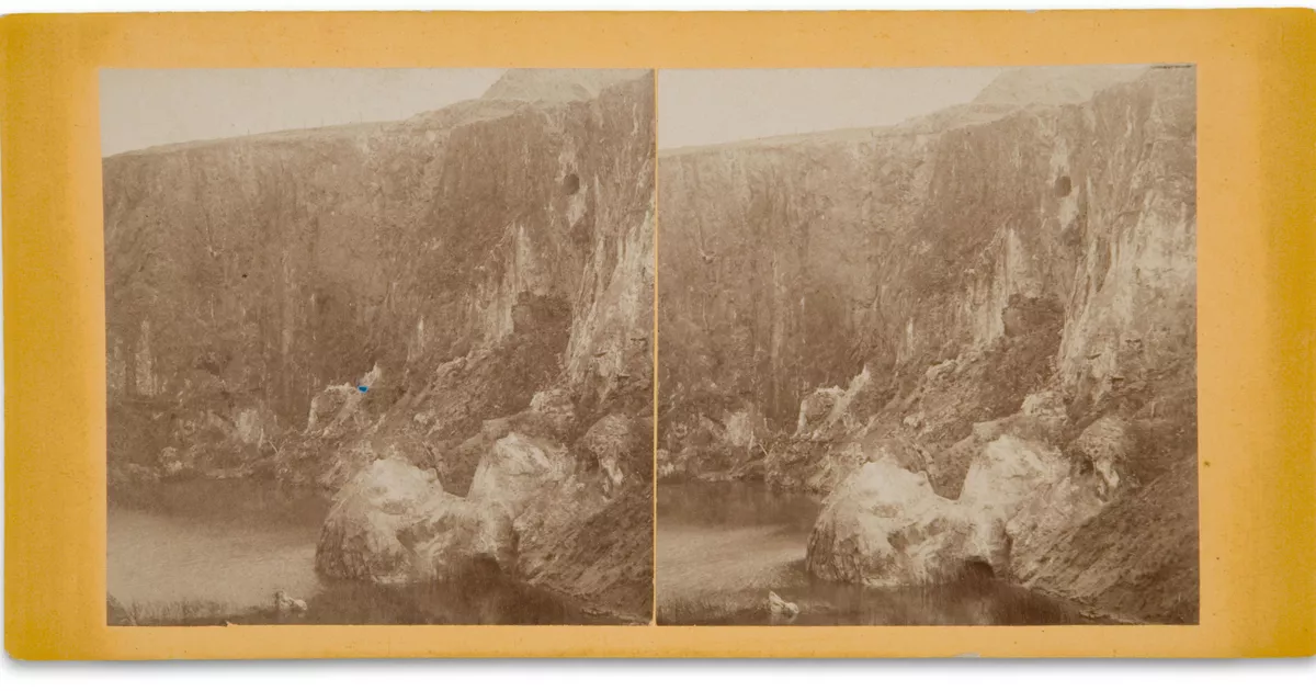 Rock face and white rock on water - AGSA Collection