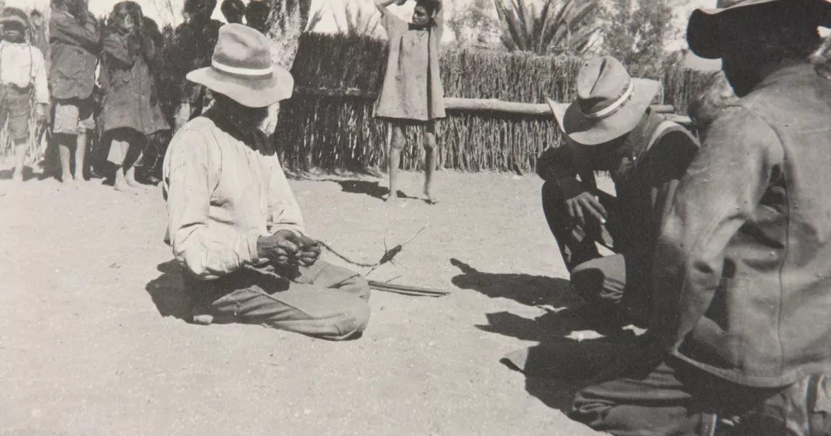 Arrernte man demonstrating spinning with spindle - AGSA Collection