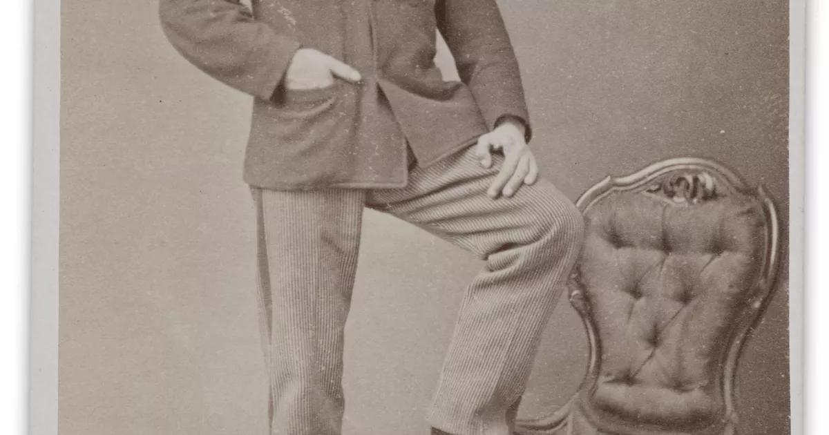 Portrait of gentleman, hand in pocket and foot on chair - AGSA Collection