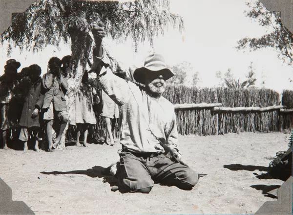 Arrernte man demonstrating spinning with spindle - AGSA Collection
