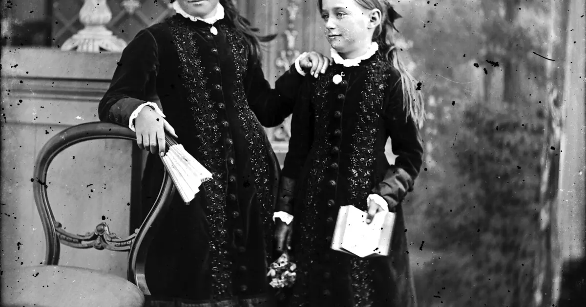 Studio portrait of two little girls wearing matching dresses - AGSA ...