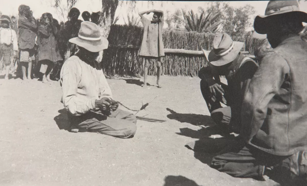 Arrernte man demonstrating spinning with spindle - AGSA Collection