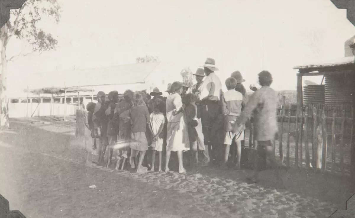 Group of Arrernte children surrounding adults - AGSA Collection