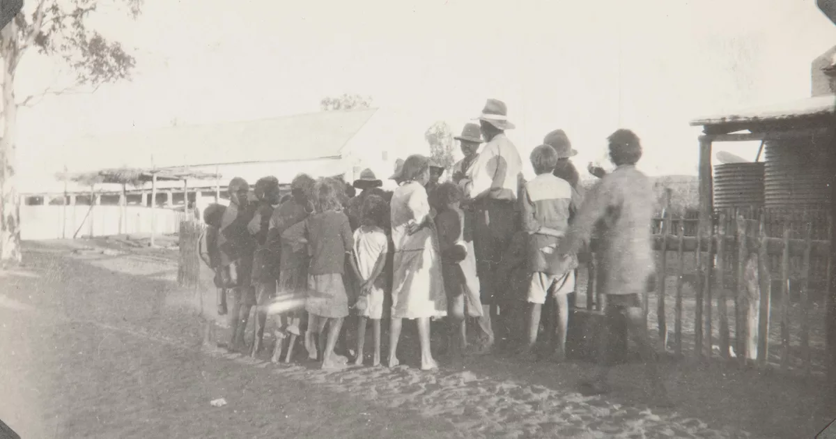 Group of Arrernte children surrounding adults - AGSA Collection