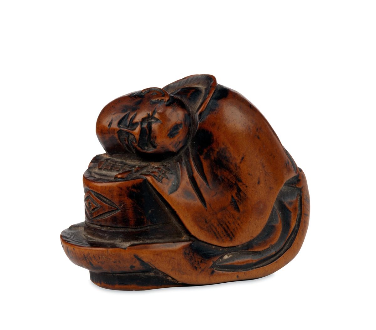 Netsuke, monk resting on a tea or flour mill - AGSA Collection