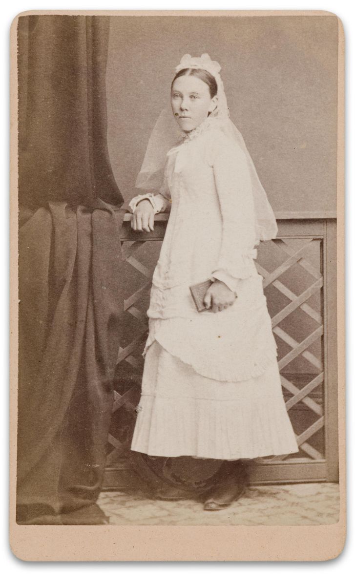 Portrait of girl wearing confirmation gown - AGSA Collection