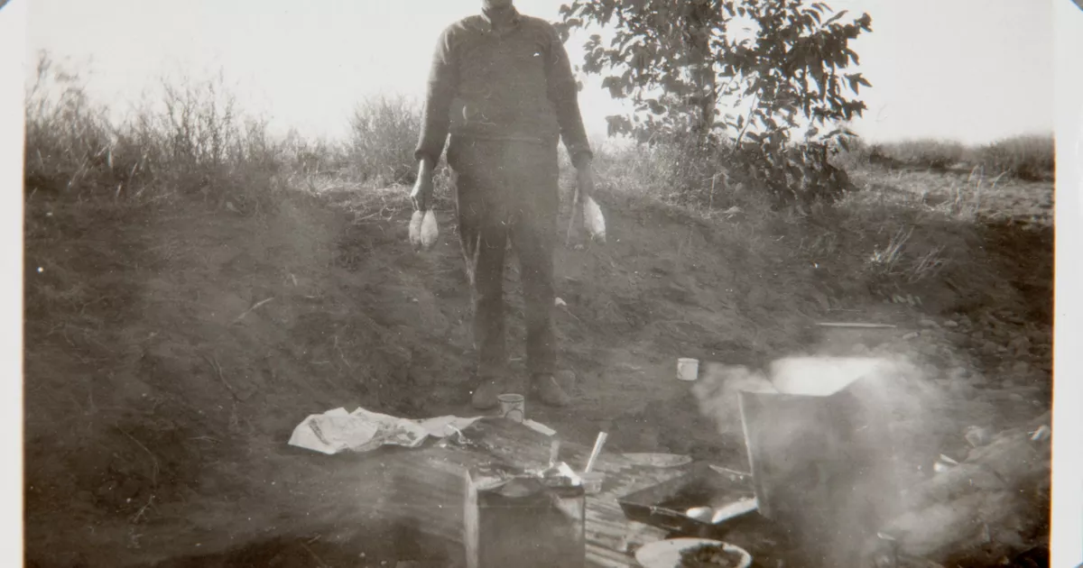 Camp cook with fish - AGSA Collection